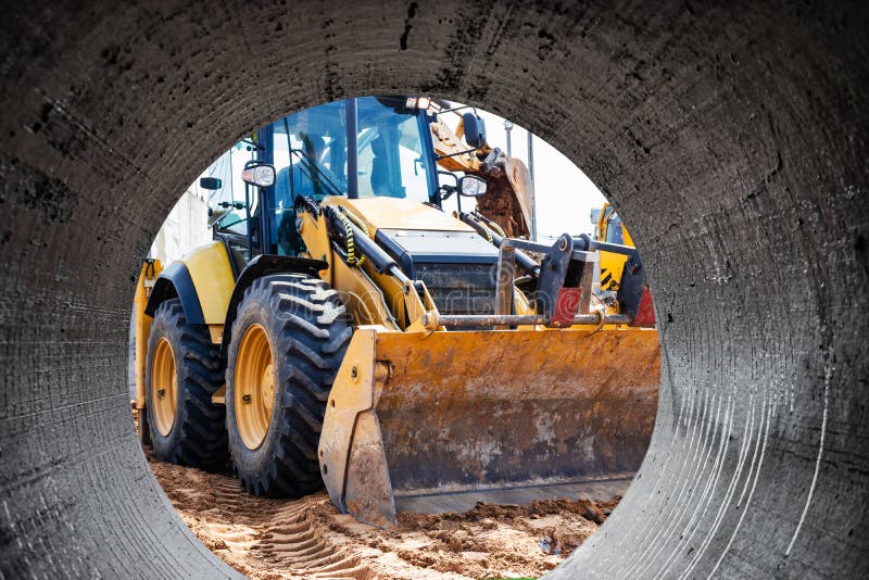 The Excavator Loader Works with a Bucket for Transporting Sand at a ...