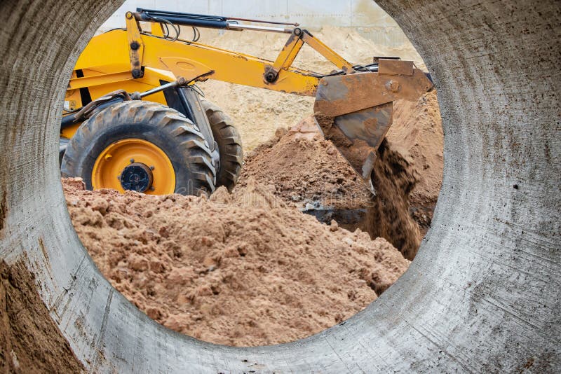 The Excavator Loader Works with a Bucket for Transporting Sand at a ...