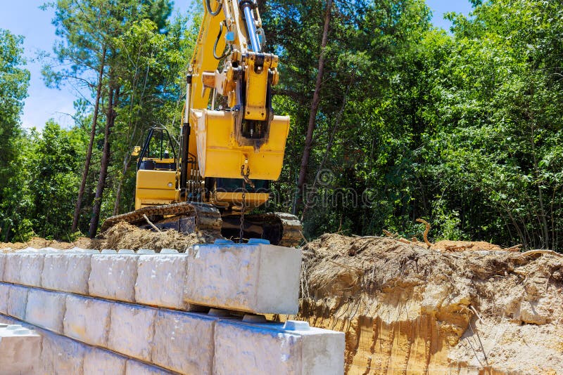Excavator Loading Blocks at Forest Construction Site during Build ...