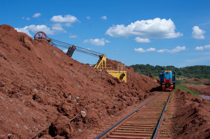 Excavator Loading Clay To the Train Stock Photo - Image of industrial ...