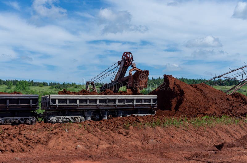 Excavator Loading Clay To the Train Stock Image - Image of train, clay ...
