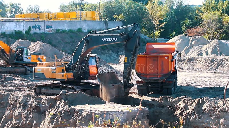 The Excavator Loading Crushed Stone into a Dump Truck in a Crushed ...