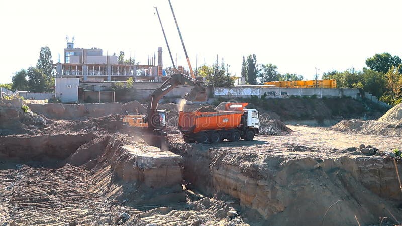 The Excavator Loading Crushed Stone into a Dump Truck in a Crushed ...