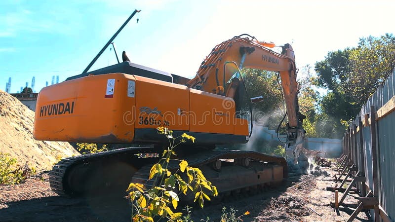 The Excavator Loading Crushed Stone into a Dump Truck in a Crushed ...