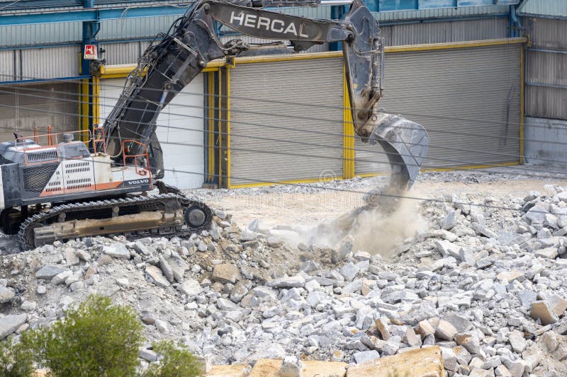 Excavator Loading Debris into Pile at Construction Site Editorial ...
