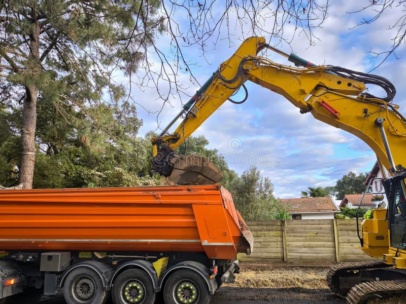 Excavator Loading a Dump Truck Stock Image - Image of fence, hydraulic ...