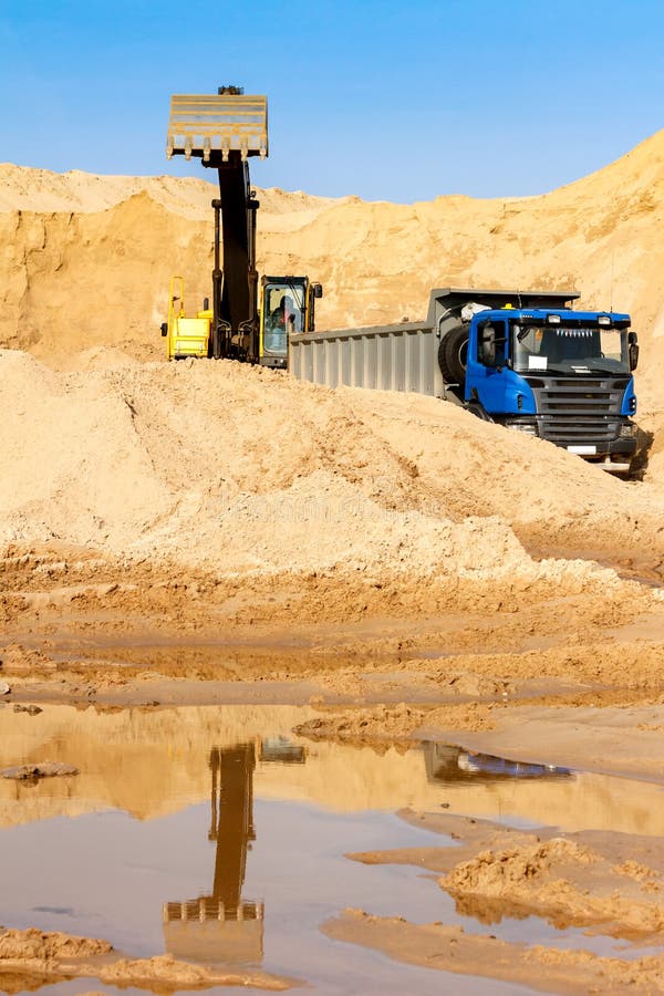 Excavator Loading Dumper Truck Stock Photo - Image of large, building ...