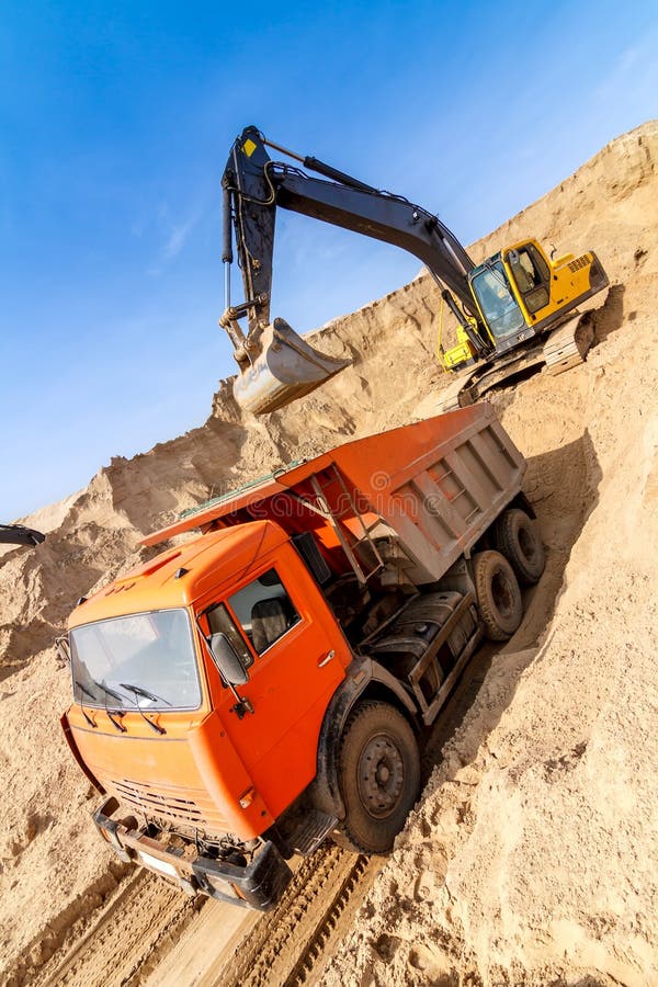 Excavator Loading Dumper Truck Stock Photo - Image of equipment ...