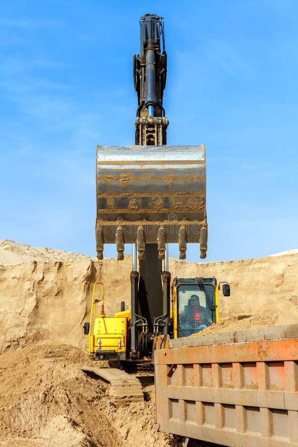 Excavator Loading Dumper Truck Stock Image - Image of truck, shovel ...