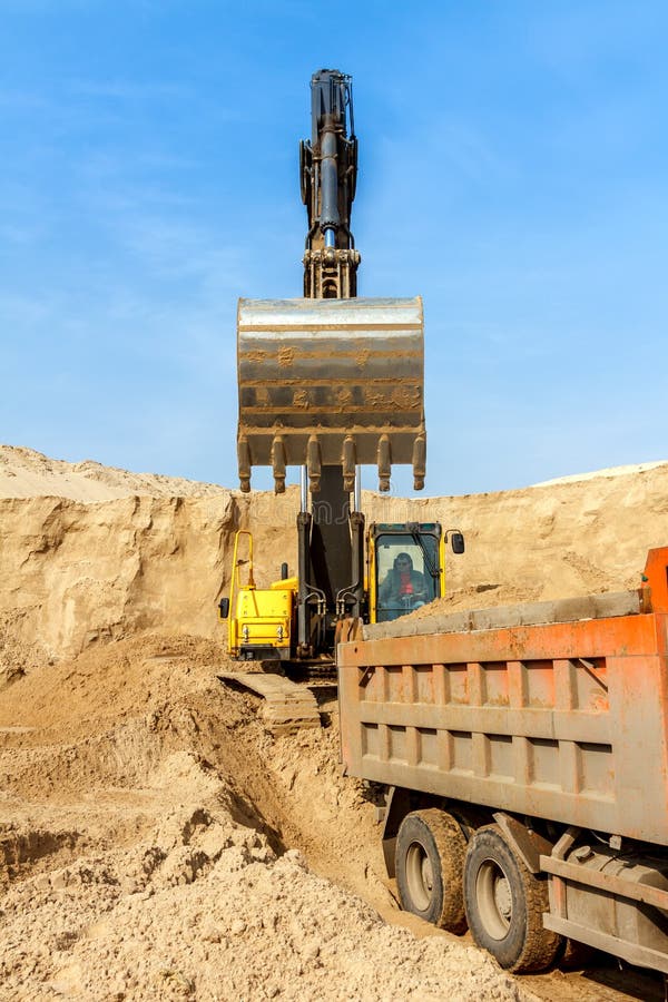 Excavator Loading Dumper Truck Stock Photo - Image of excavator ...