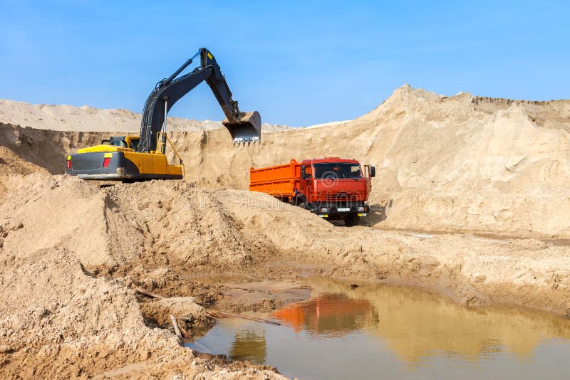 Excavator Loading Dumper Truck Stock Photo - Image of large, excavator ...