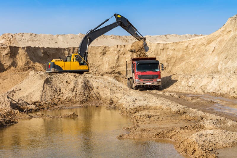Excavator Loading Dumper Truck Stock Photo - Image of digging, earth ...