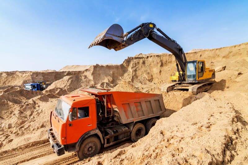 Excavator Loading Dumper Truck at Sunny Day Stock Photo - Image of ...