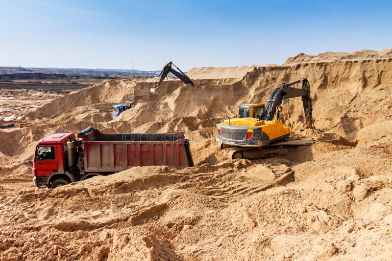 Excavator Loading Dumper Truck at Sunny Day Stock Photo - Image of sand ...