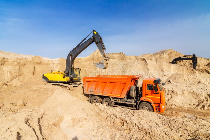 Excavator Loading Dumper Truck at Sunny Day Stock Image - Image of ...