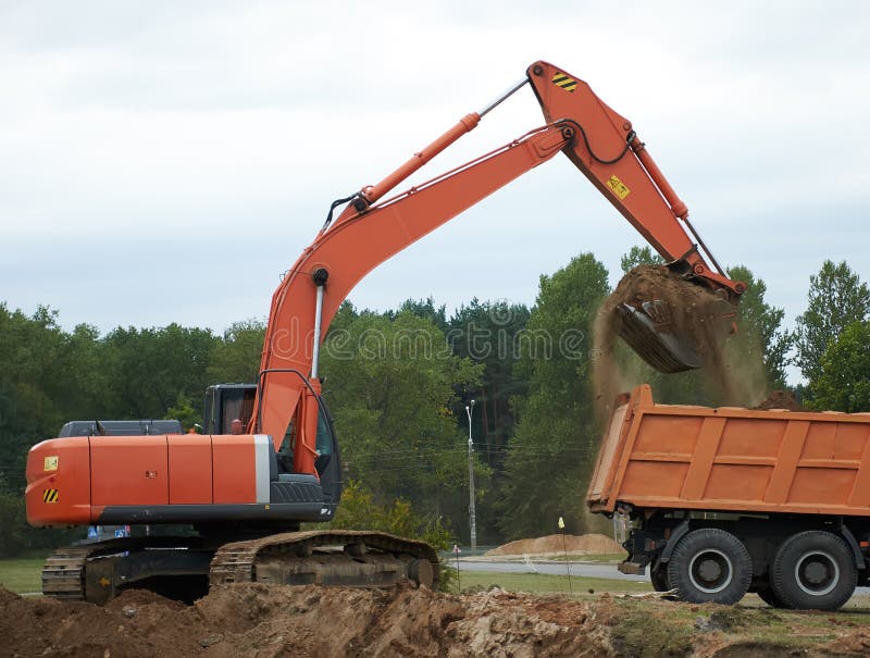 Excavator Loading Dumper Truck Stock Photo - Image of pour, field: 36345106