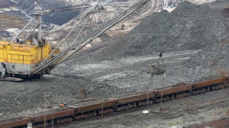Loading Iron Ore into a Mining Excavator Close-up. Bucket of a Mining ...