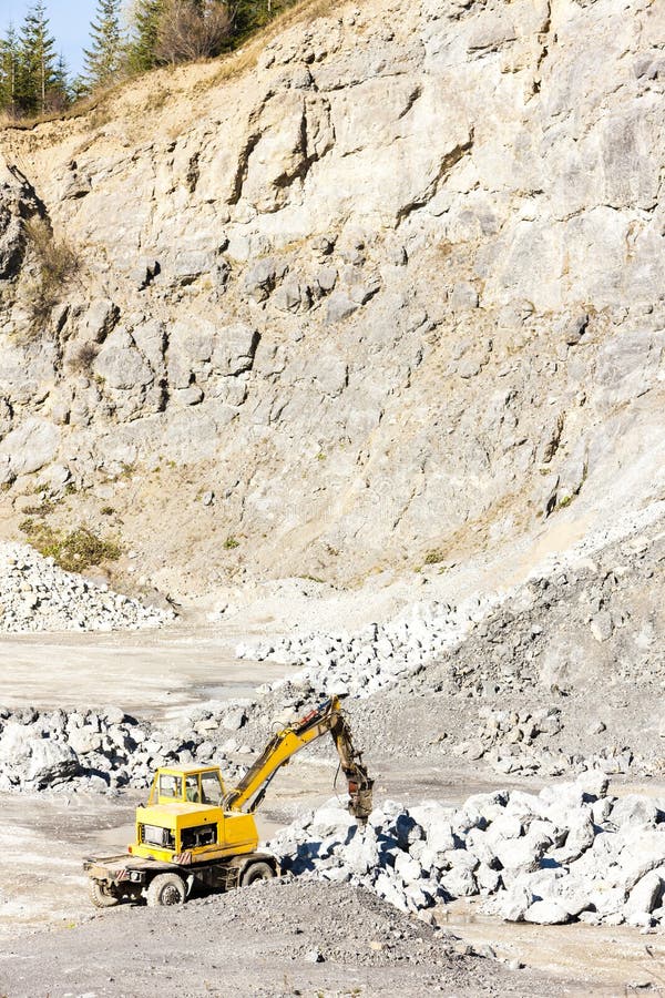 Excavator Loading Rocks at Quarry Stock Photo - Image of machine ...
