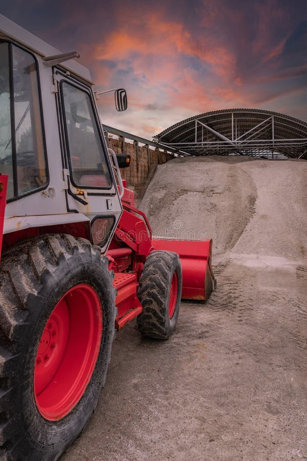 Excavator Loading Salt for Road Treatment in Winter Stock Photo - Image ...