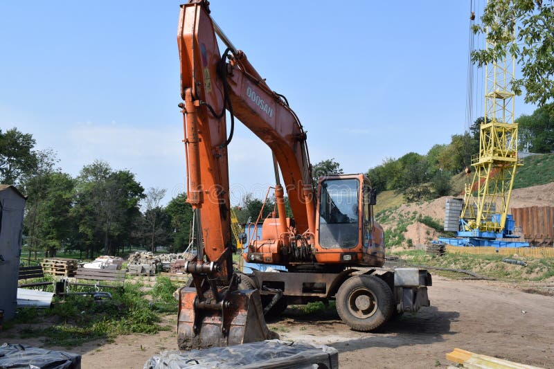 Excavator Loading Sand into the Back of a Truck Stock Photo - Image of ...
