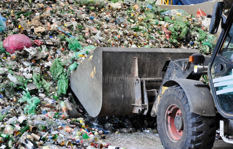 Excavator Loading Trash, Unrecognizable Worker in a Waste Recycling ...