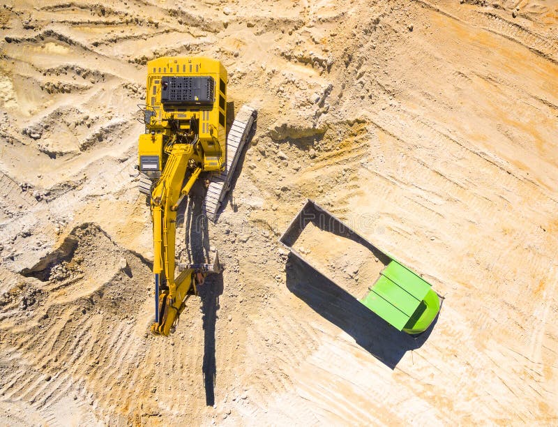 Excavator loading a truck. stock image. Image of development - 84870075