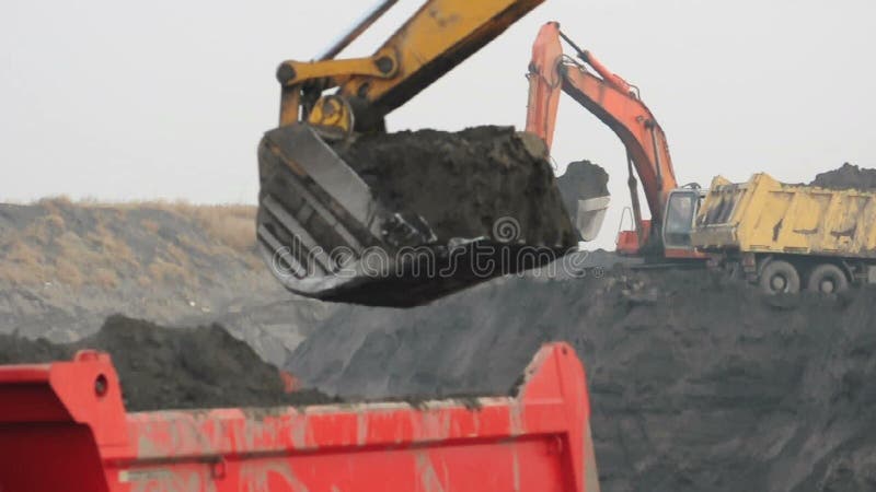 Excavator loading truck stock video footage. Video of equipment - 34884965
