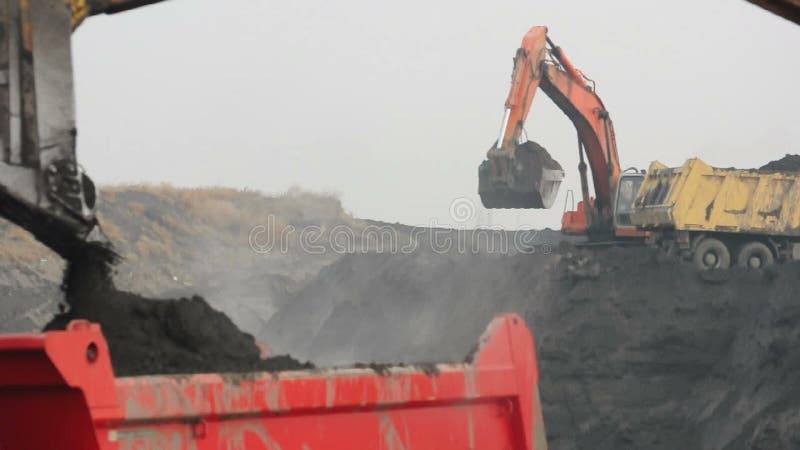 Excavator loading truck stock video footage. Video of equipment - 34884965