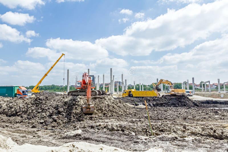 Excavator is Loading a Truck on Building Site Stock Image - Image of ...