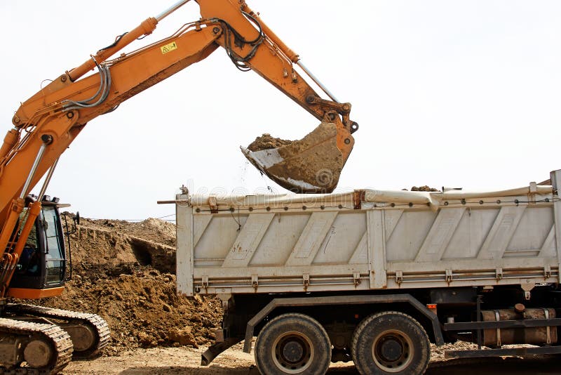 Excavator loading stock image. Image of construction - 102862461