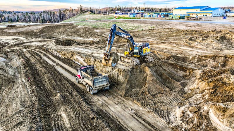 Excavator Loading Truck at Construction Site. Stock Image - Image of ...