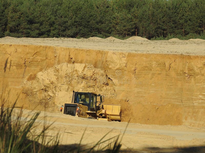 Excavator Loading Sand stock image. Image of loads, excavator - 104287489