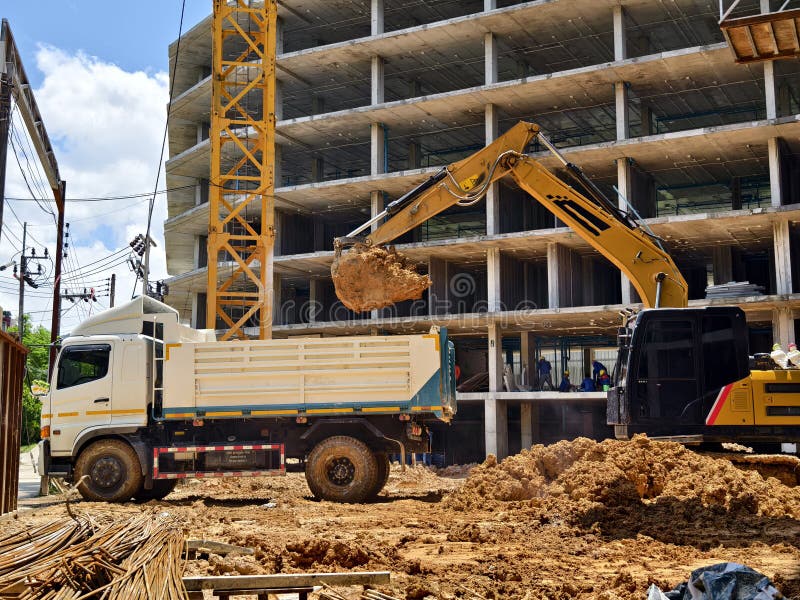 Excavator Loads Ground into a Dump Truck at a Construction Site Stock ...