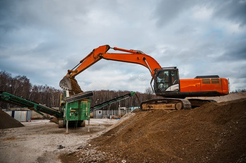 Excavator Loads Soil in Mobile Crushing and Sorting Complex Stock Image ...