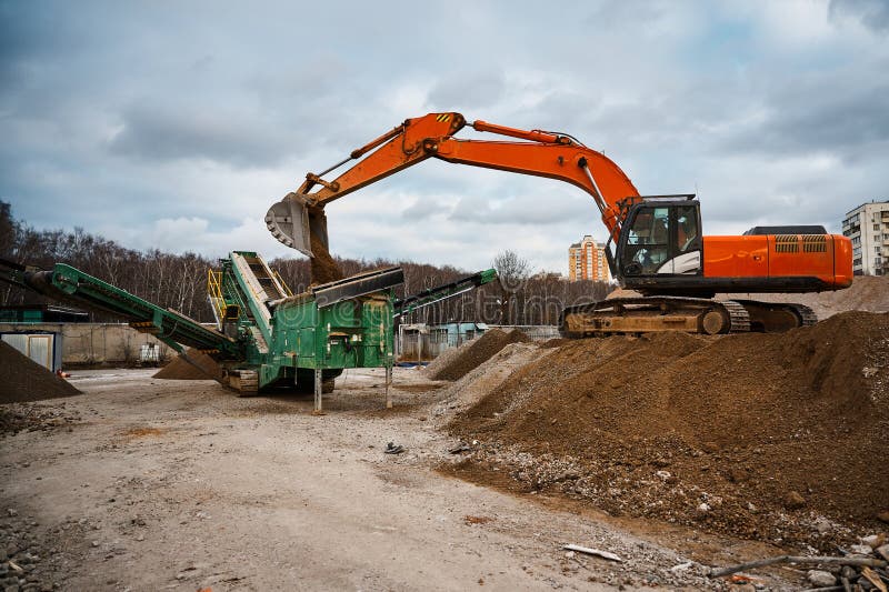 Excavator Loads Soil in Mobile Crushing and Sorting Complex Stock Image ...