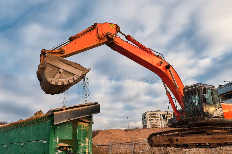 Excavator Loads Soil in Mobile Crushing and Sorting Complex Stock Photo ...