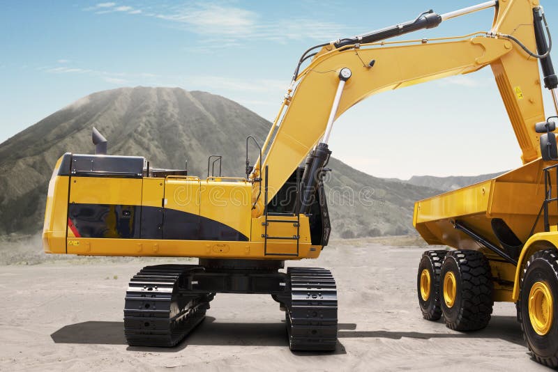 Excavator Loads Soil into a Truck at Outdoors Stock Photo - Image of ...