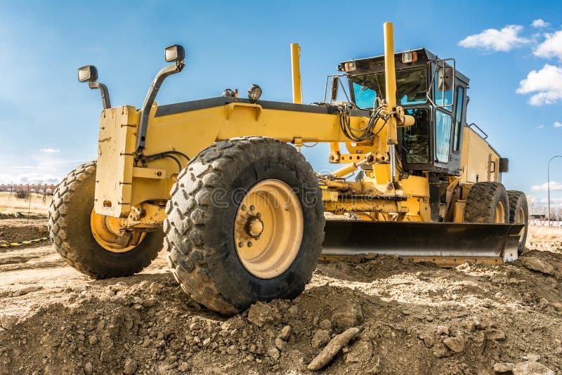 Excavator Machine Leveling the Ground with a Large Shovel Stock Photo ...