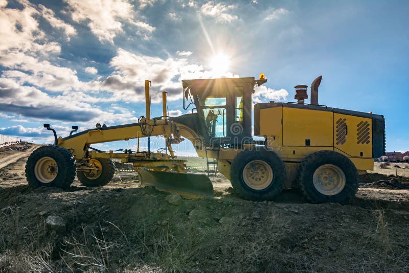 Excavator Machine Leveling the Ground with a Large Shovel Stock Photo ...