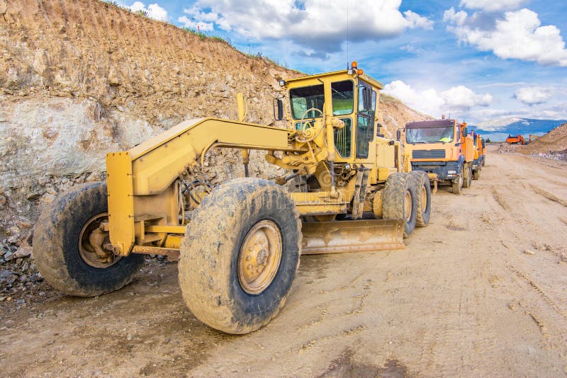 Excavator Machine Leveling the Ground with a Large Shovel Stock Photo ...