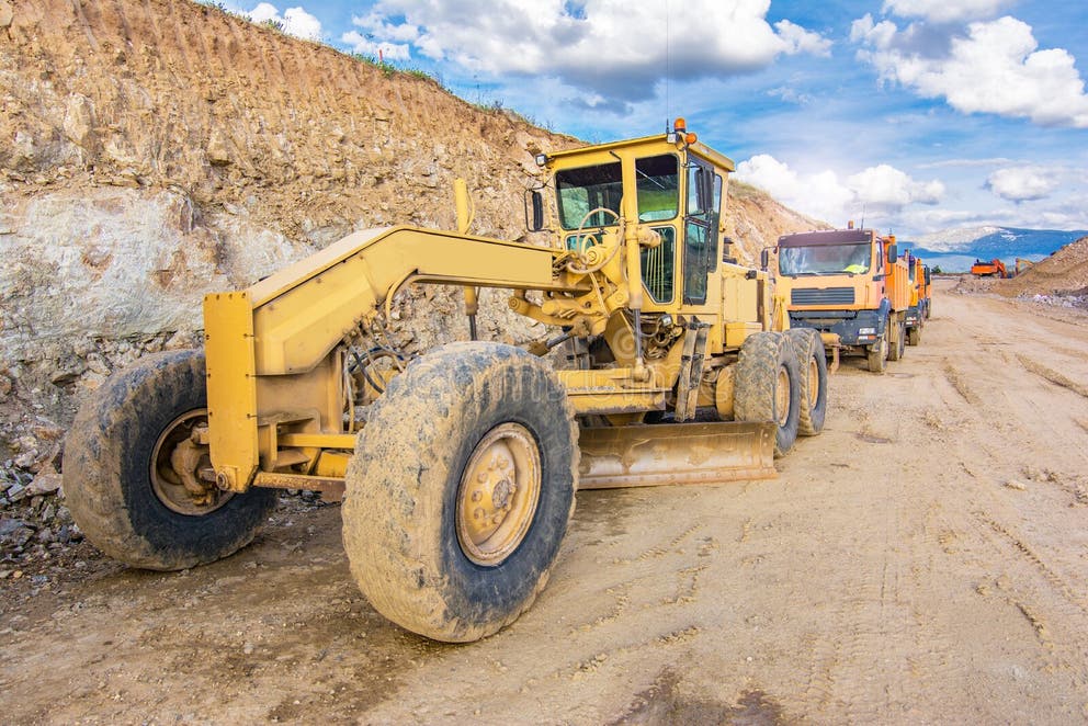 Excavator Machine Leveling the Ground with a Large Shovel Stock Photo ...