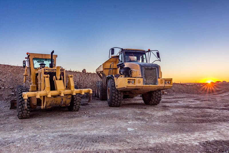 Excavator Machine Leveling the Ground with a Large Shovel Stock Photo ...