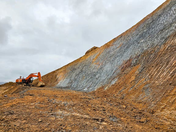 Excavator Machine Profiling Slopes and Bench in Open Pit Mine Stock ...