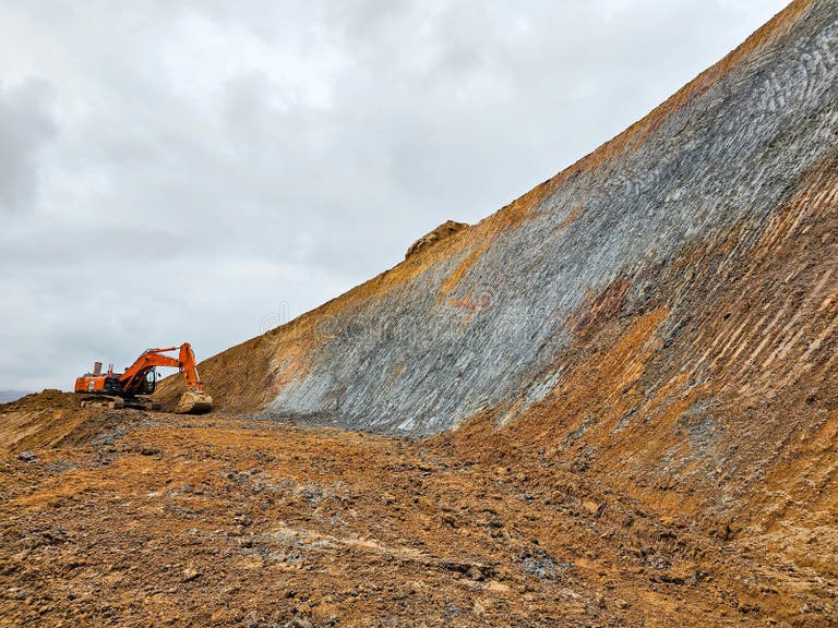 Excavator Machine Profiling Slopes and Bench in Open Pit Mine Stock ...
