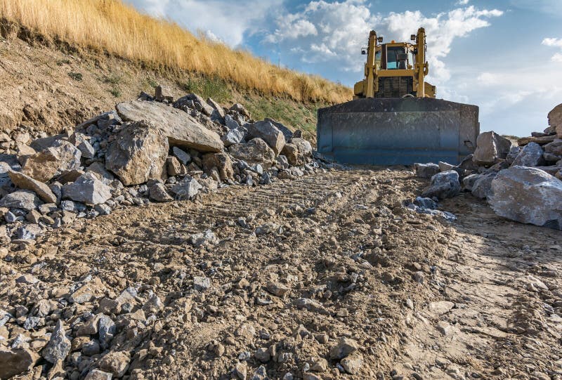 Excavator Making a Ditch in the Construction of a Road Stock Photo ...