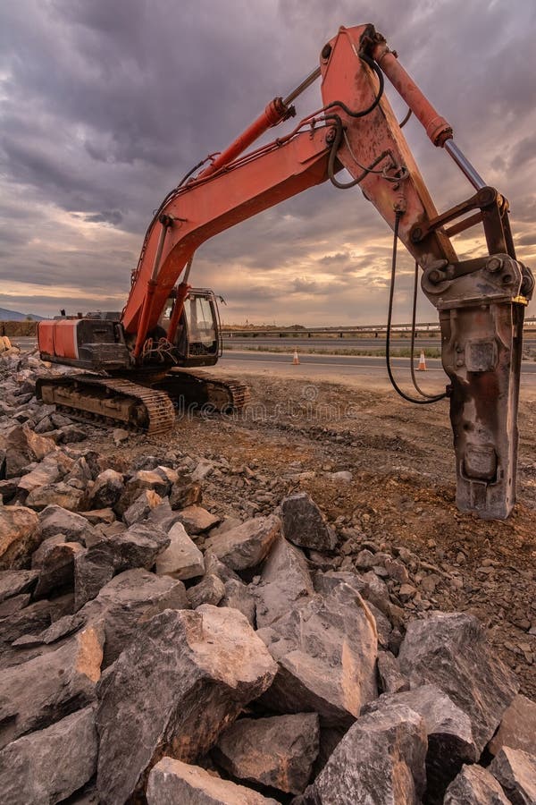 Excavator Making Earth Movements for the Construction of a Road Stock ...