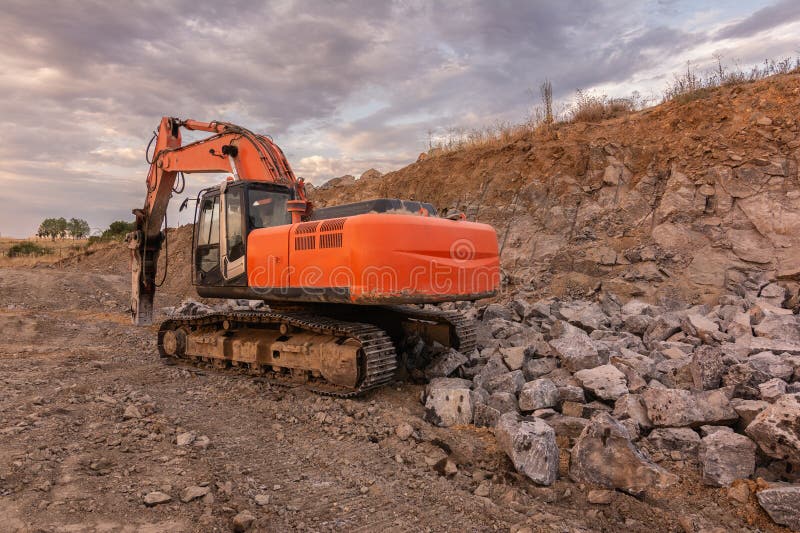 Excavator Making Earth Movements for the Construction of a Road Stock ...