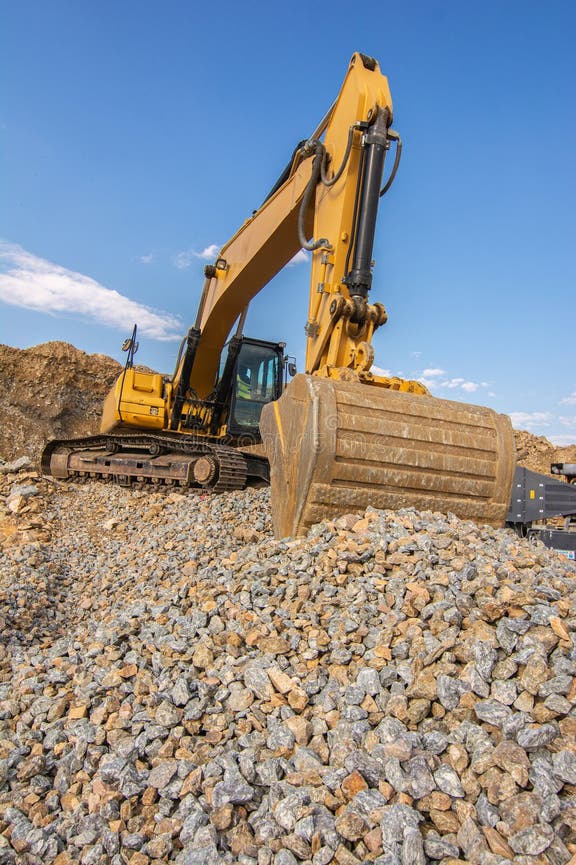 Excavator Making Earth Movements for the Construction of a Road Stock ...