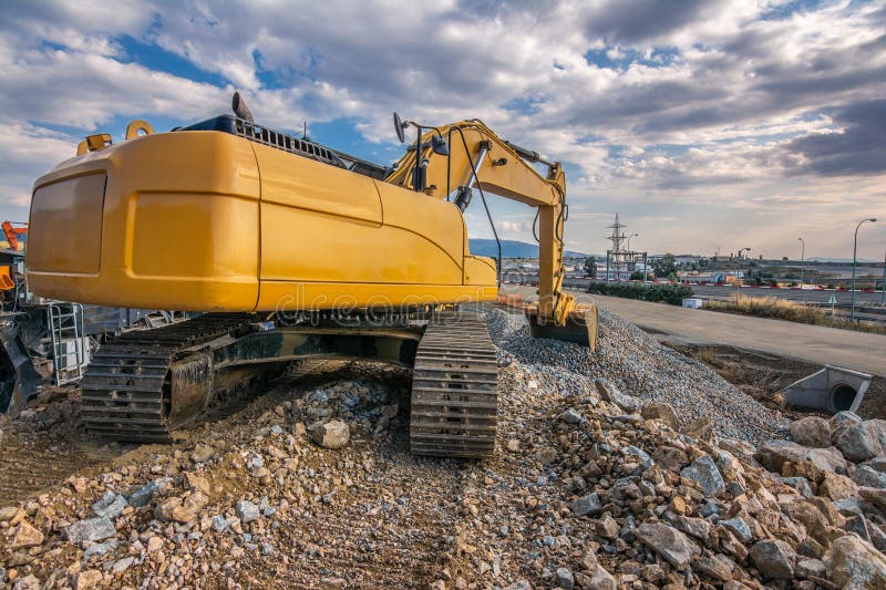 Excavator Making Earth Movements for the Construction of a Road Stock ...