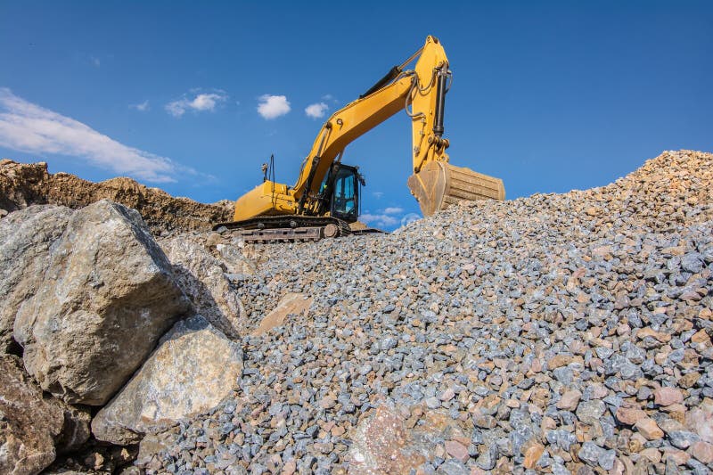 Excavator Making Earth Movements for the Construction of a Road Stock ...